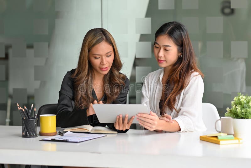 College Students are Looking at Digital Tablet Computer Stock Image ...