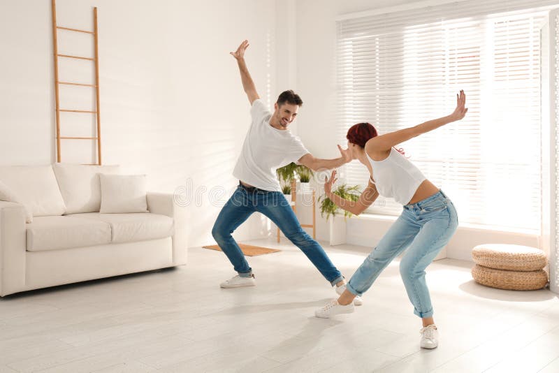Beautiful Young Couple Dancing in Room Stock Image - Image of indoors ...