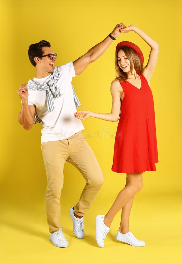 Beautiful Young Couple Dancing on Yellow Stock Image - Image of ...