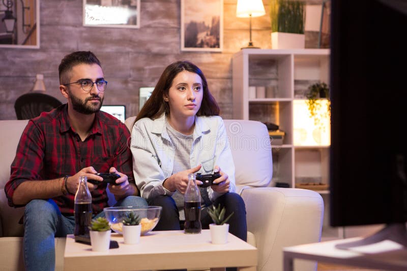 Beautiful Young Couple Having Fun Playing Video Games Stock Photo ...