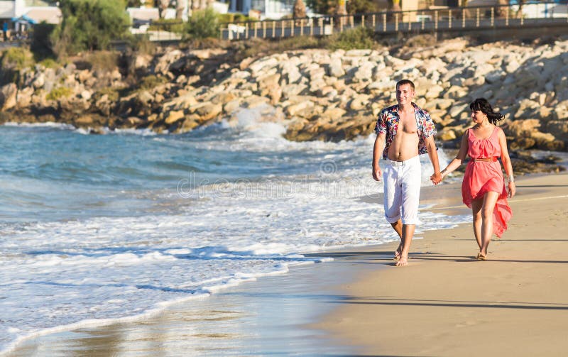 Beautiful Young Couple in Love Enjoying and Having Fun at the Beach ...