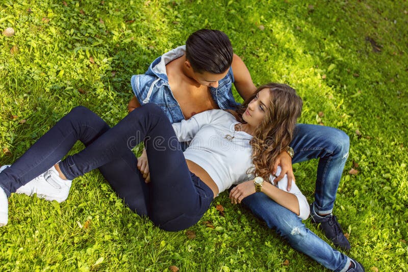 Young Couple Lying On Grass Field Stock Image Image Of Green