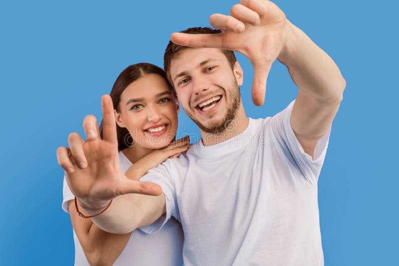 Beautiful Young Couple is Making Frame, Looking at Camera Stock Photo ...