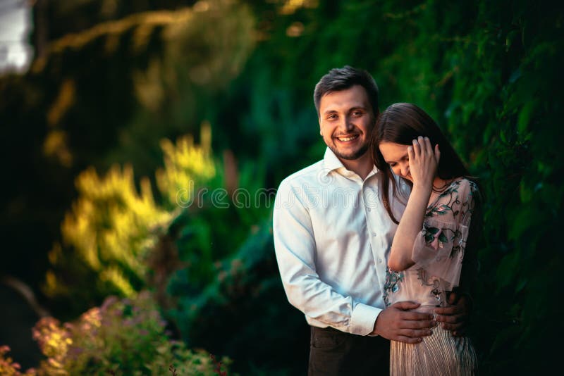 Beautiful Young Couple on a Nature Background Stock Photo - Image of ...