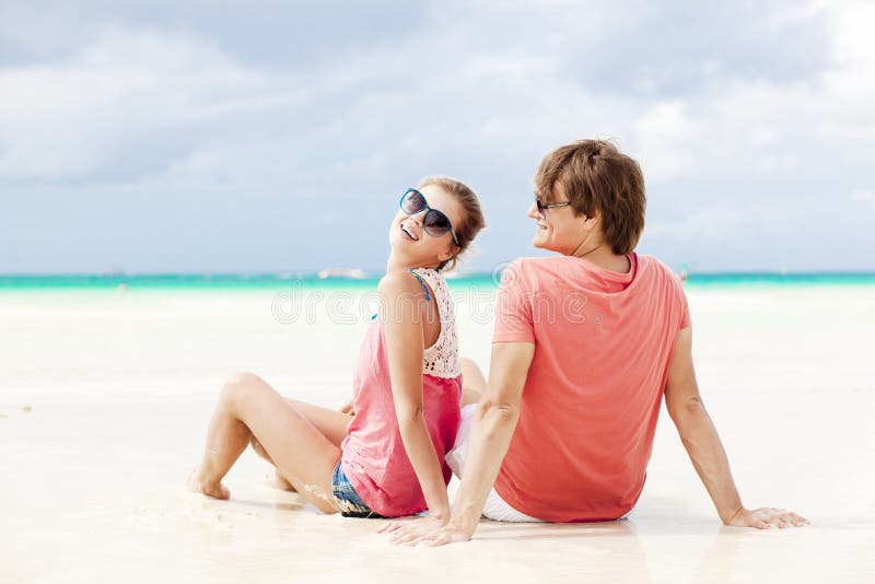 Beautiful Young Couple Sitting and Having Fun on Stock Image - Image of ...
