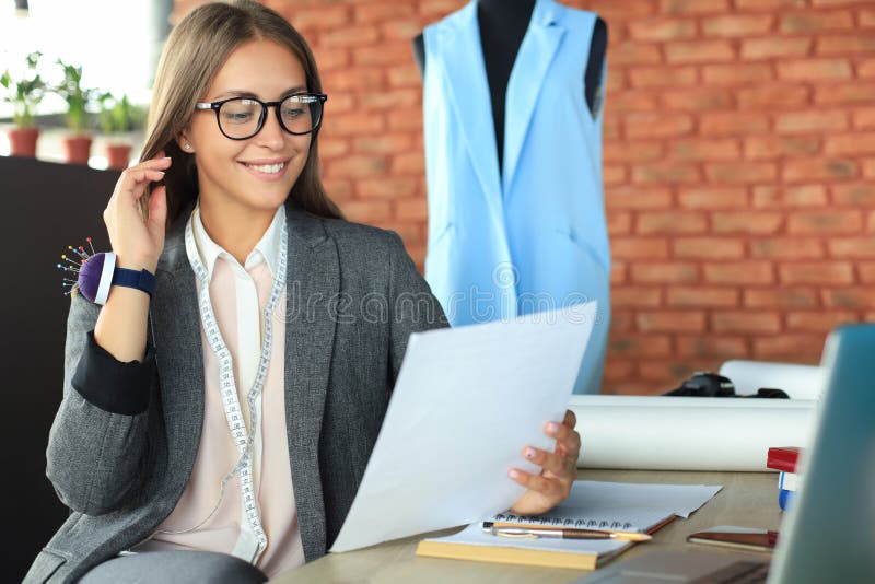 Beautiful Young Designer Working on Sketches while Sitting in Her ...