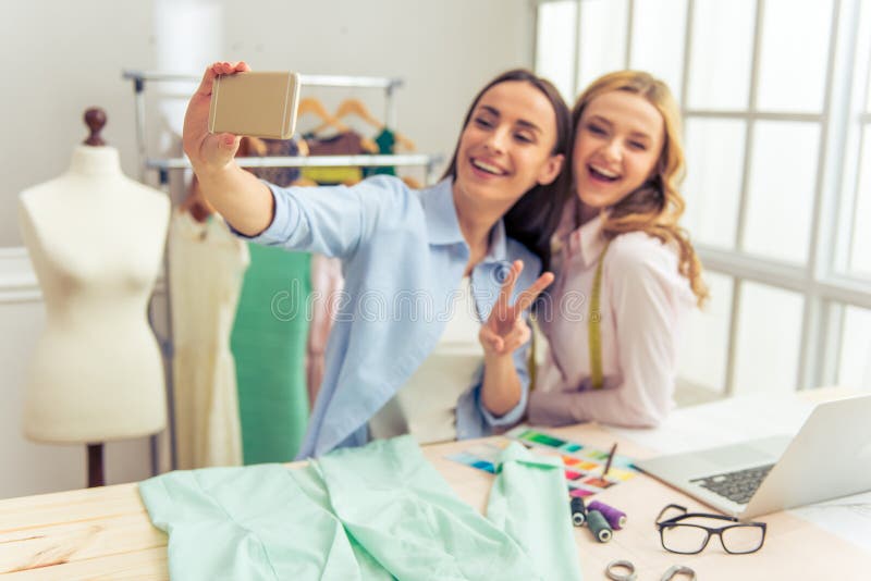 Beautiful Young Designers with Gadget Stock Image - Image of ...