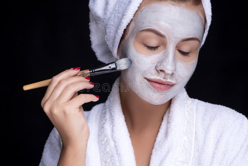 Beautiful Young European Woman Apply Clay Mask On Her Face Beauty Spa