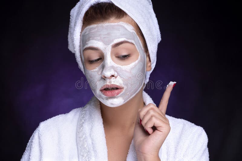 Beautiful Young European Woman Apply Clay Mask On Her Face Beauty Spa