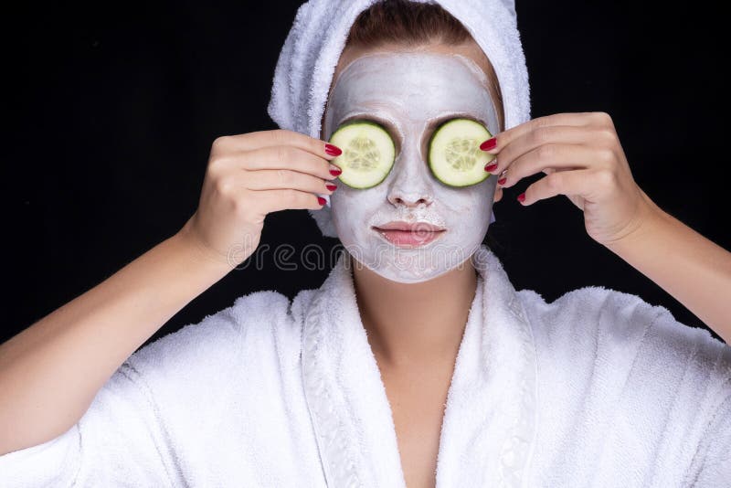 Beautiful Young European Woman Apply Clay Mask On Her Face With Towel