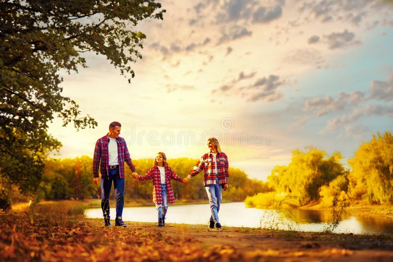 Beautiful Young Family on a Walk in Autumn Forest Stock Photo - Image ...