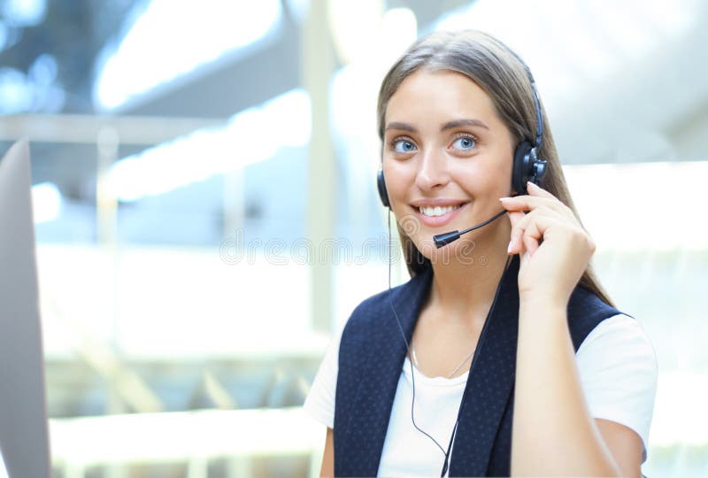 Beautiful Young Female Call Center Operator with Headset in Office ...
