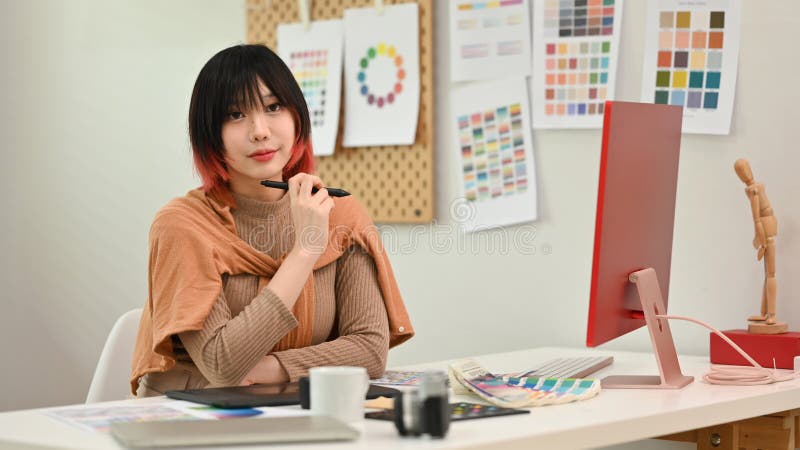 Beautiful Young Female Designer Using Graphics Tablet and Working with ...