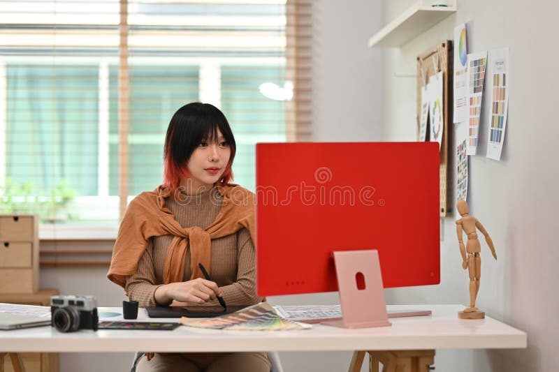 Beautiful Young Female Designer Using Graphics Tablet and Working with ...