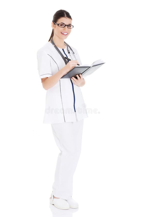Beautiful Young Female Doctor Writing in a Workbook. Stock Image ...
