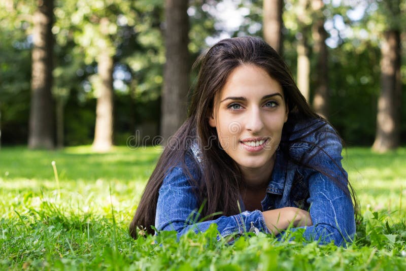 Beautiful Young Female Lying on Grass Stock Image - Image of fashion ...