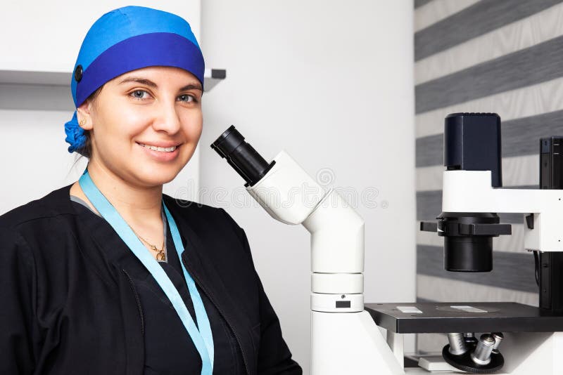 Beautiful Young Female Scientist in the Laboratory Next To an Inverted ...