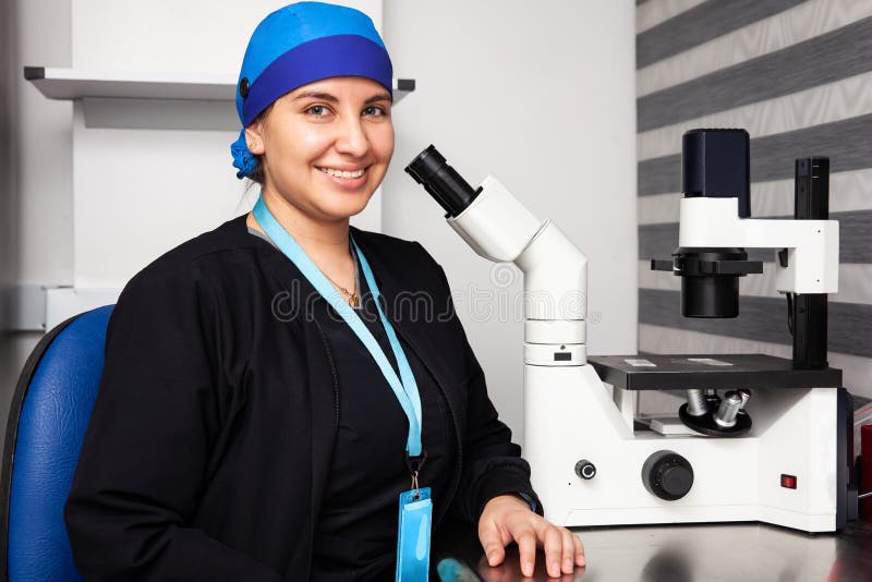 Beautiful Young Female Scientist in the Laboratory Next To an Inverted ...