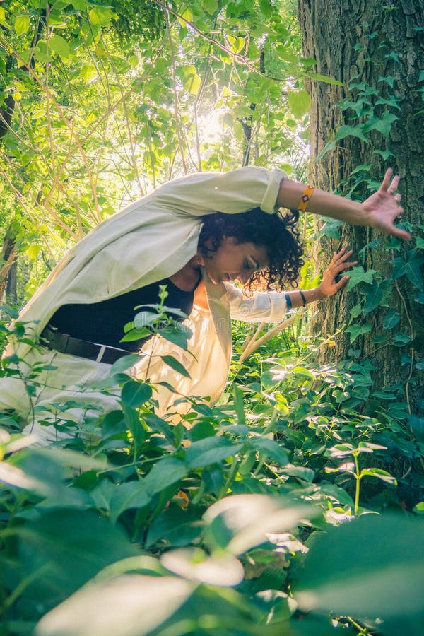 Beautiful Young Female Stretching Using a Tree in a Park Stock Image ...