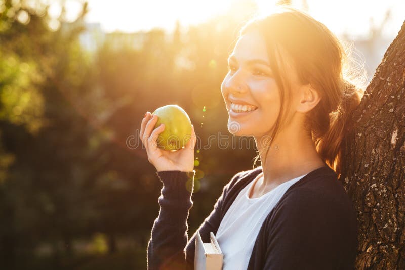 Beautiful Young Girl Holding Apple Stock Image - Image of library ...