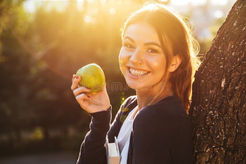 Beautiful Young Girl Holding Apple Stock Image - Image of attractive ...