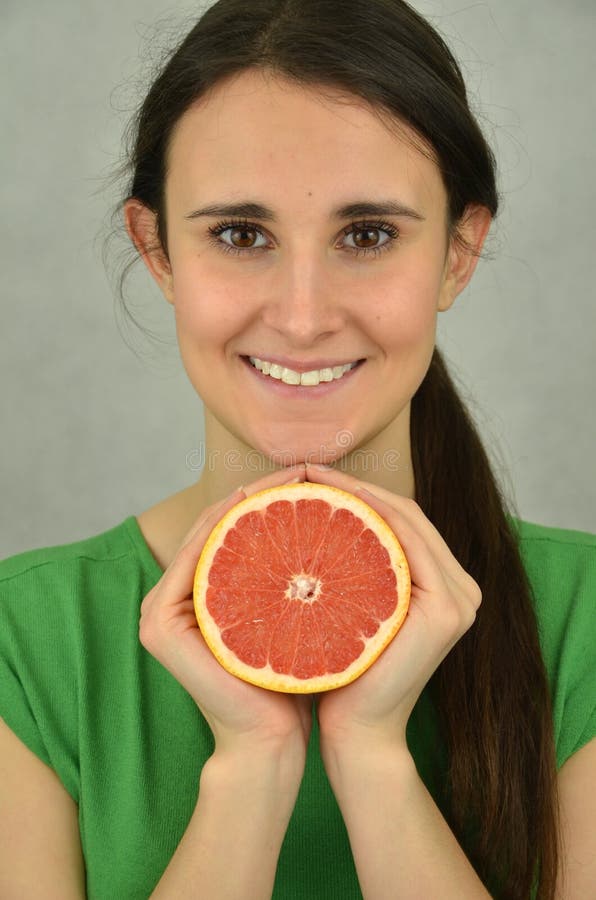 Beautiful Young Girl is Holding a Red Grapefruit Stock Image - Image of ...