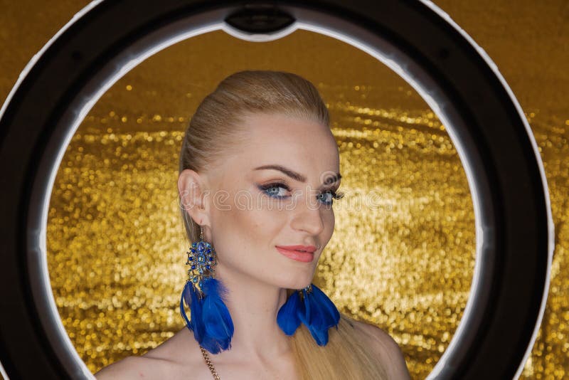 Beautiful Young Girl Looking at the Camera through a Ring Lamp. Stock ...