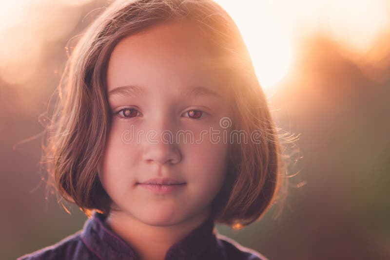 Beautiful Young Girl Looking at Camera at Sunset Stock Photo - Image of ...
