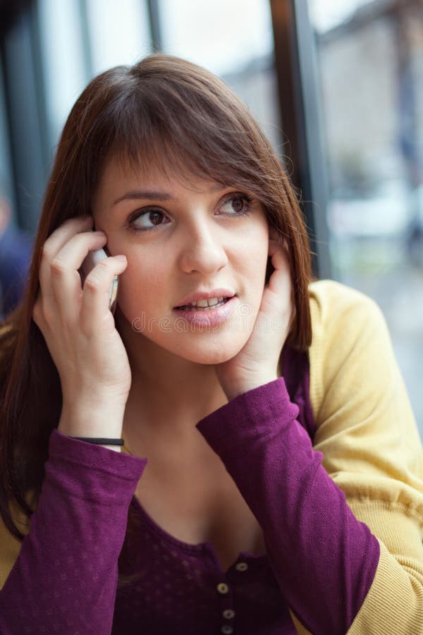 Beautiful Young Girl on the Phone in a Cafe Stock Photo - Image of cute ...