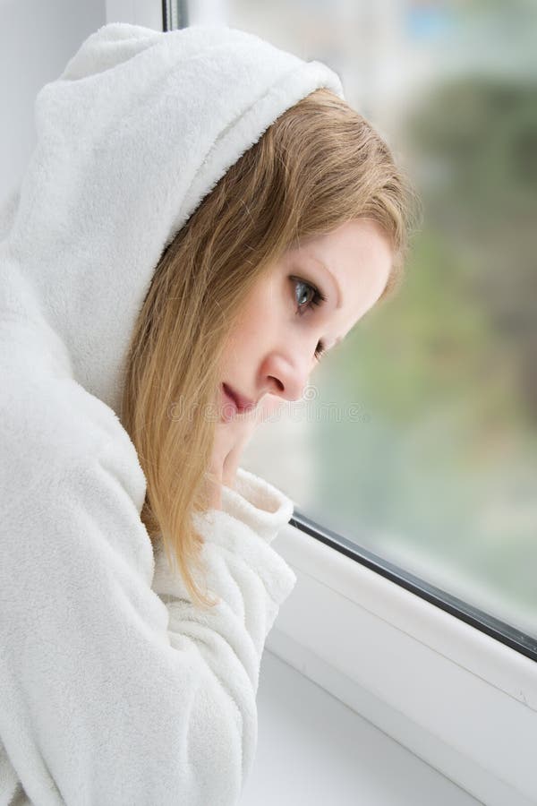 Beautiful Young Girl is Sad at the Window Stock Photo - Image of light ...