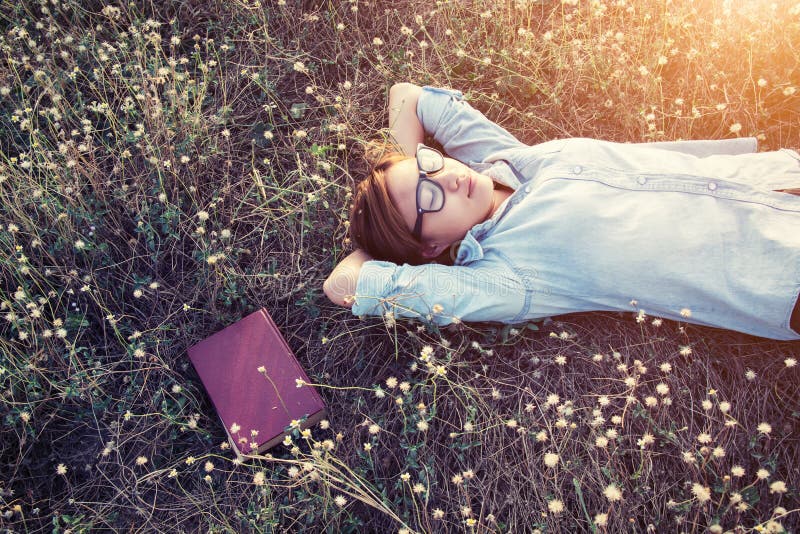 Beautiful Young Hipster Laying Down on the Meadows Field Smiley Stock ...