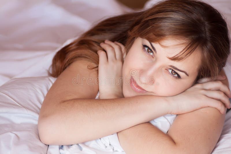 Beautiful Young Lady Lying on the Bed. Stock Image - Image of brown ...