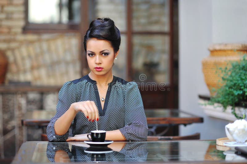 Beautiful Young Lady Sitting in the Cafe for a Cup of Coffee Stock ...