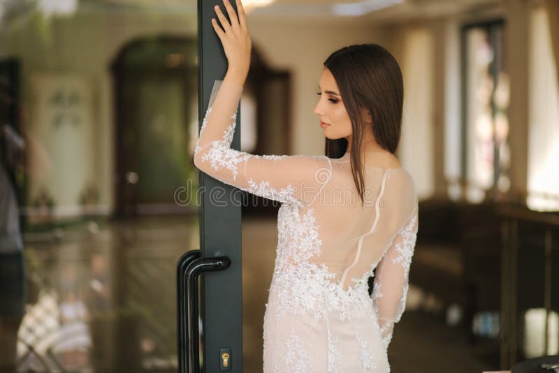 Beautiful Young Model in Evening Drees Posing To Photographer Inside ...