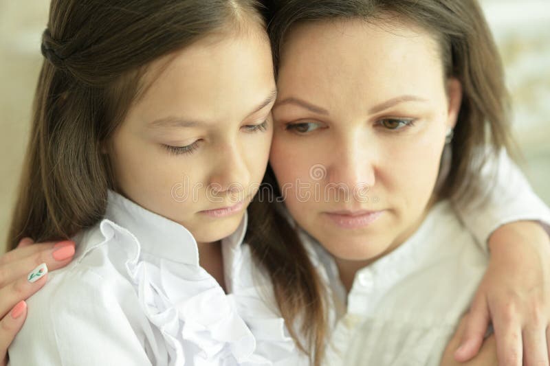 Young Beautiful Mother And Her Cute Teen Daughter Just