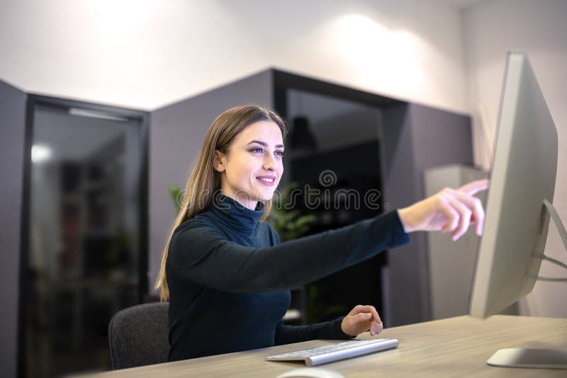Beautiful Young Office Worker Touching the Screen of the Computer Stock ...
