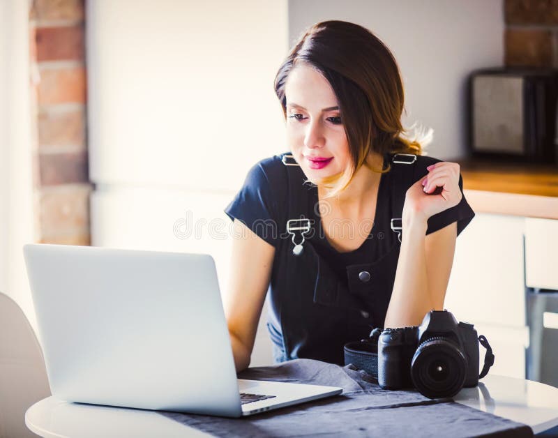 Beautiful Young Photographer Sitting at Kitchen with Camera Stock Image ...