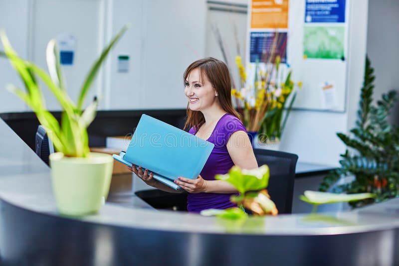 Beautiful Young Receptionist at Work Stock Image - Image of helpline ...