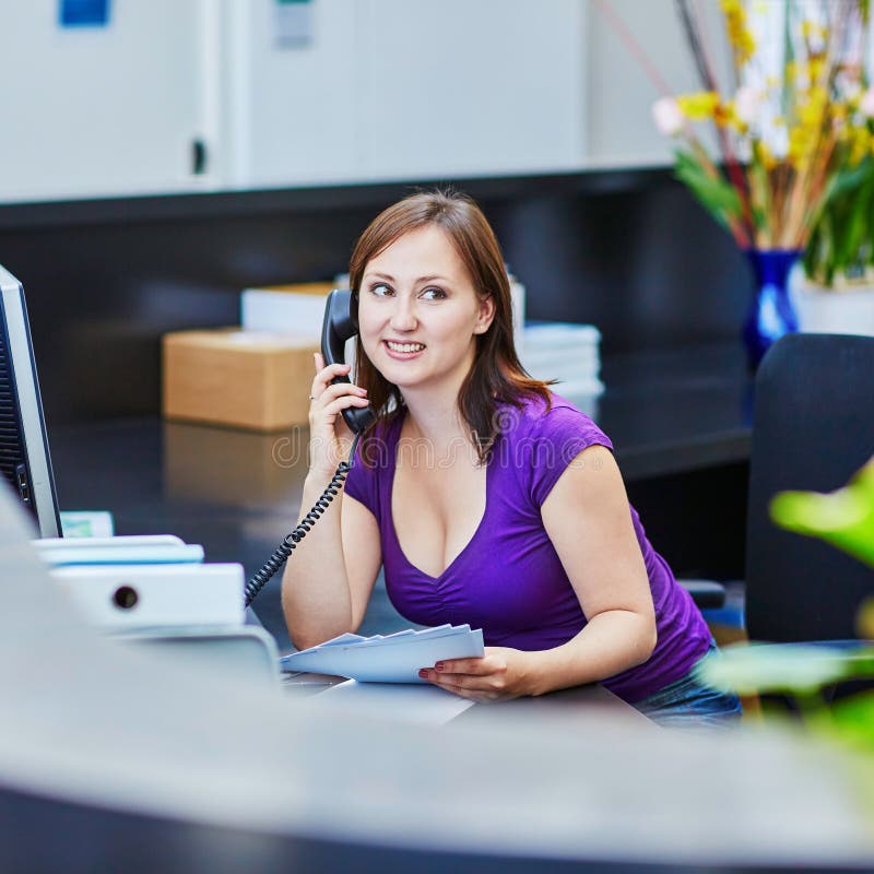 Beautiful Young Receptionist at Work Stock Photo - Image of ...