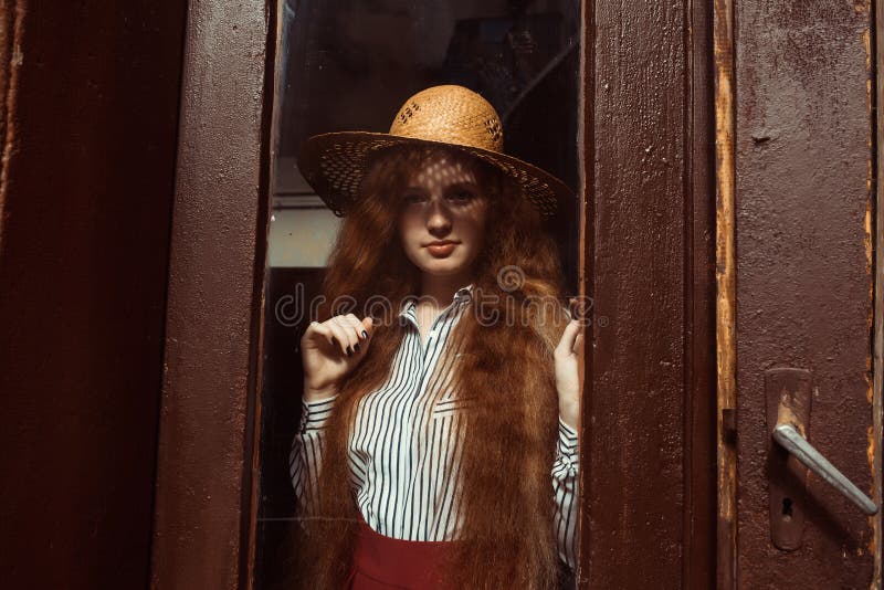 Beautiful Young Red Haired Model In Straw Hat With Shadow On Her Stock