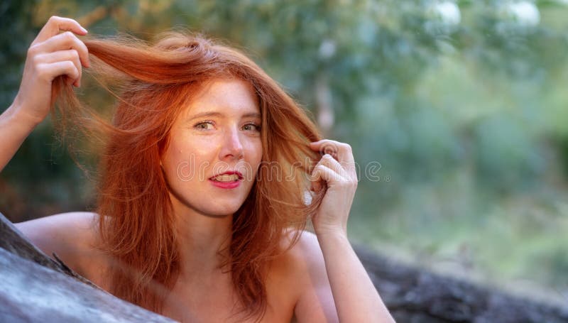 Beautiful Young Red Haired Girl Enjoys Smiling Happily Playing At Her