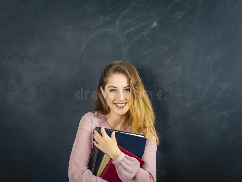 Beautiful Young Student in Front of Blackboard Stock Photo - Image of ...