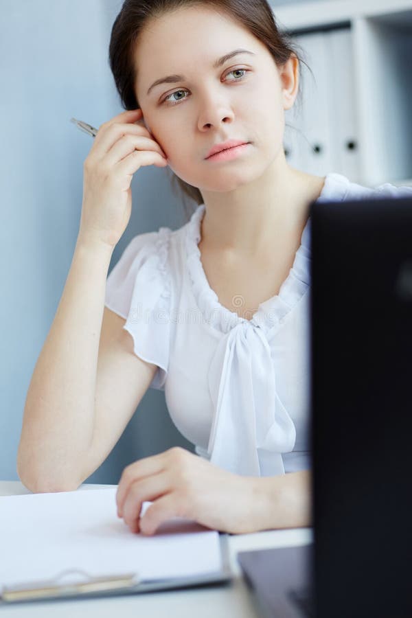 Beautiful Young Female Student or Intern Working on a Laptop in the ...