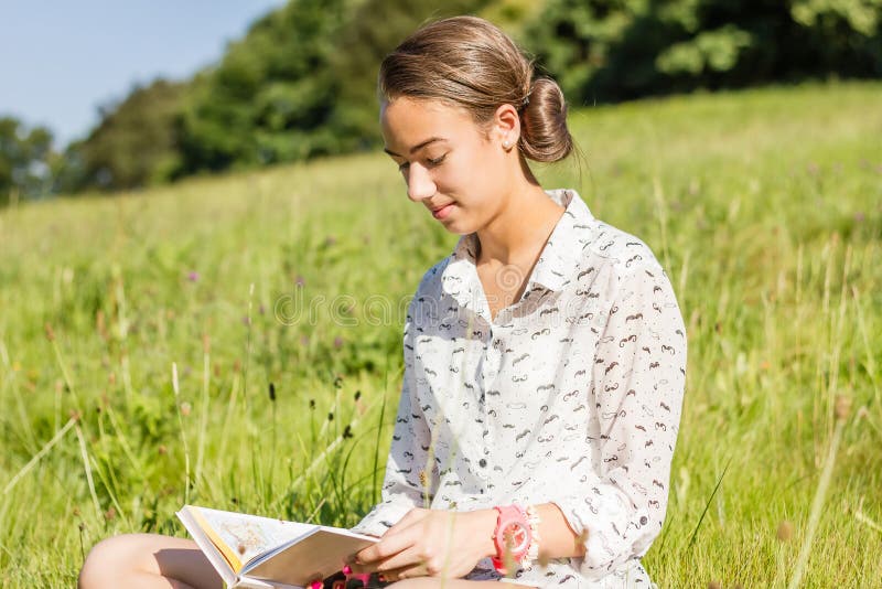 Beautiful Young Student Reading a Book in the Park Stock Photo - Image ...
