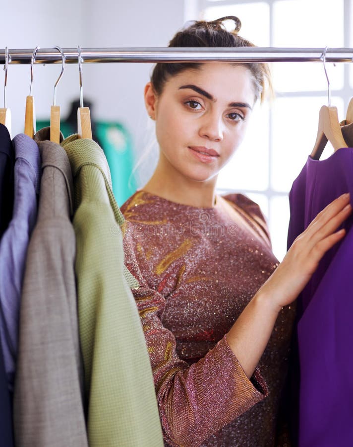 Beautiful Young Stylist Near Rack with Hangers Stock Image - Image of ...