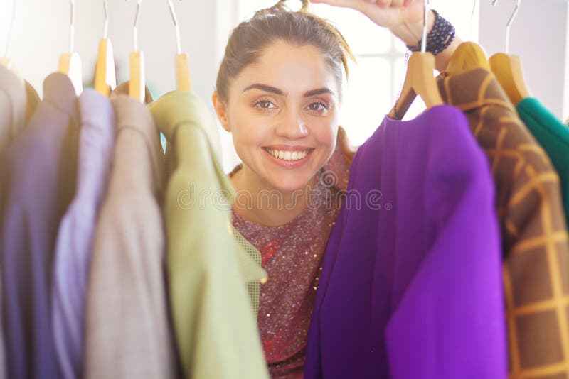 Beautiful Young Stylist Near Rack with Hangers Stock Image - Image of ...