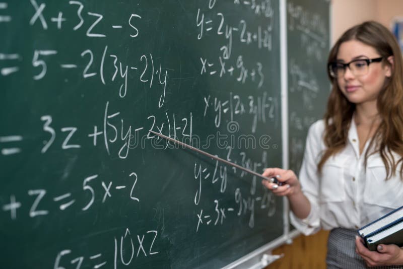 Beautiful Young Teacher Shows a Pointer To the Solution of Math ...