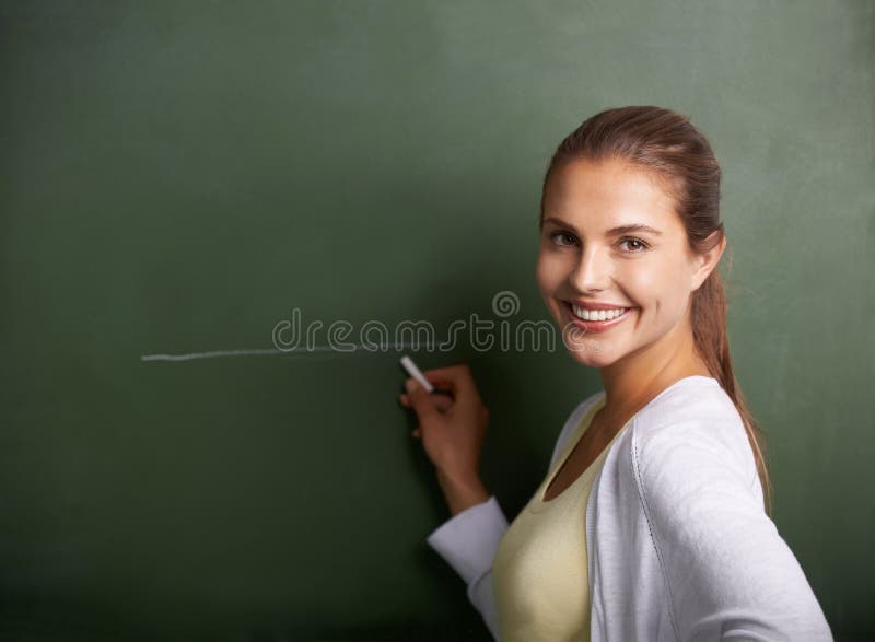 Shaping the Future Generation. a Beautiful Young Teacher Writing on a ...