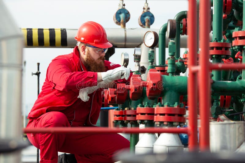 Technician in Oil and Gas Refinery. Worker in Oil Refinery Stock Image ... Technician in Oil and Gas Refinery. Worker in Oil Refinery Stock Image ...