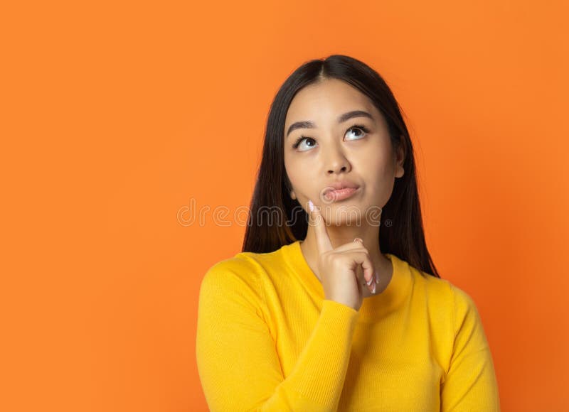 Beautiful Young Thinking Woman Thoughtful on Orange Background, Copy ...
